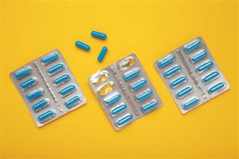 Premium Photo Blister Pack With Medicines On Yellow Background Top