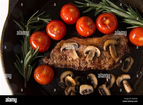 Grilling Strip Loin Steak In Cast Iron Frying Pan Steak Is Cooked And
