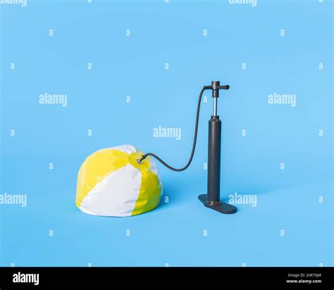 3d Rendering Of A Deflated Yellow And White Beach Ball Attached To A