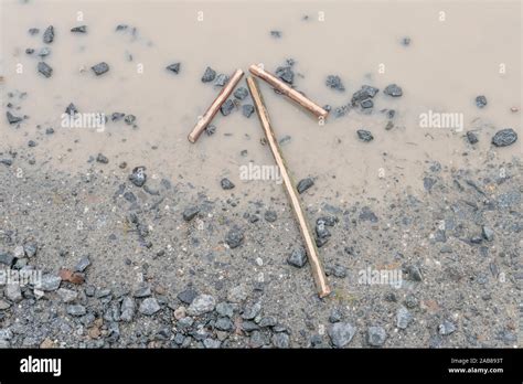 Survival Skills Concept Signal Arrow On Gravel Proceed This Way