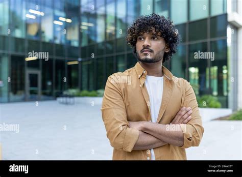 Portrait Of A Young Indian Male Programmer Developer Standing With