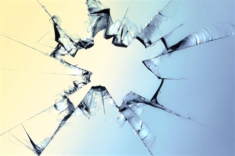 Premium Photo A Splintered Glass With A Hole Concept Broken Glass
