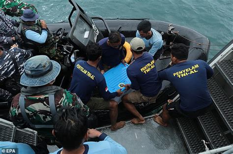 Indonesian Plane Crash Victims Remains Sprayed With Disinfectant After