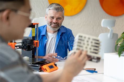 architects making house model working with 3d printer creating process