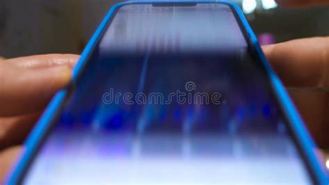 Extreme Close Up Of Finger Scrolling Through Social Network Feed Stock
