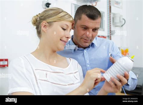 Woman Reading The Gas Meter Stock Photo Alamy