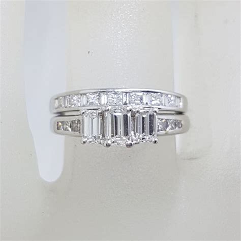 18ct White Gold Baguette And Princess Cut Diamond Trilogy Engagement