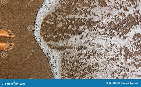 Woman Legs Barefoot At Sea Foam Waves On Sand Beach Summer Day Top