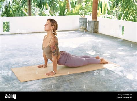 Woman Practicing Advanced Yoga On Organic Mat Series Of Yoga Poses