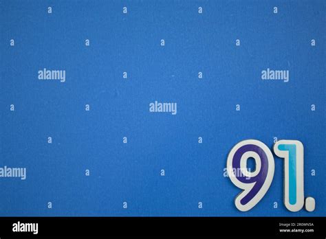 The Number 91 In Light Blue Color Photographed From Above Placed On