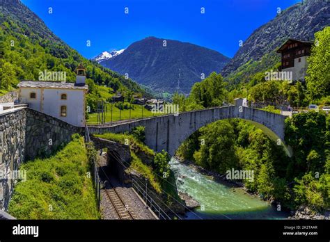 Ancient Stone Bridge Over The Moutnain River In Swiss Alps Stal Stock