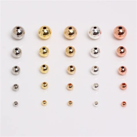 Hc 1108 【 100pcs 包】14k包金保色圓珠 轉運隔珠 小金珠光面銅珠 串珠 定位珠 Diy手工材料包 蝦皮購物