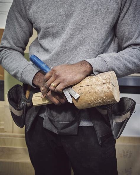 Premium Photo Midsection Of Carpenter Holding Wood And Chisel