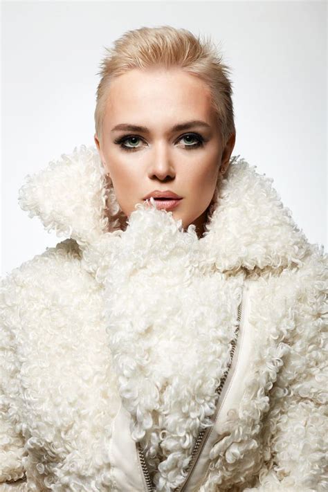 Young Short Blond Hair Woman In White Fur Beautiful Bald Girl Stock