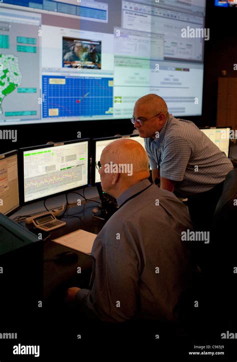 Workers Inside Command Center Of The Electric Reliability Council Of