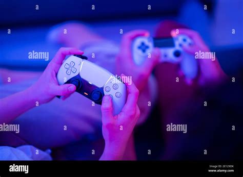 Girl Using New Sony Playstation 5 DualSense Wireless Controller Which Offers Immersive Haptic