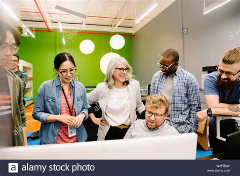 Computer Programmers Discussing Hi Res Stock Photography And Images Alamy