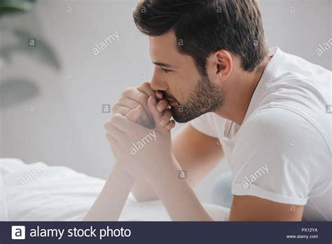Partial View Of Man Holding Wifes Hand At Home Stock Photo Alamy