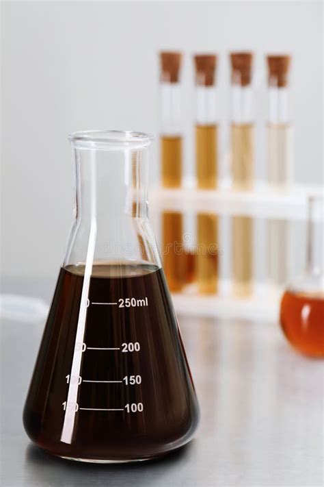 Conical Flask With Brown Liquid On Table Stock Image Image Of Light Biochemistry 268155249
