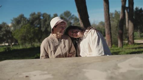 Mother And Daughter Sharing A Tender Moment In The Park Stock Video