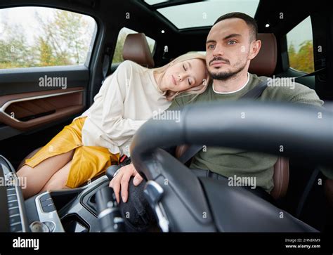 Happy Man And Woman Traveling In Car Beautiful Young Couple Sitting On