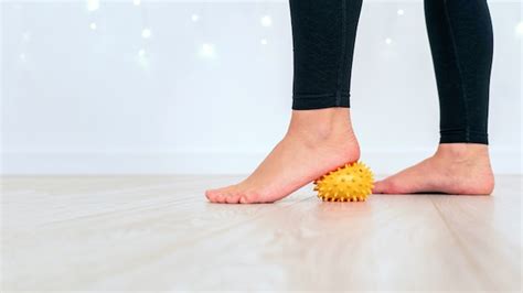 Premium Photo Foot Pressing On A Ball