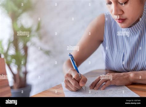Business Women Use Pen Writing Document Paper Female Hand Close Up Writing With A Blue Pen On A