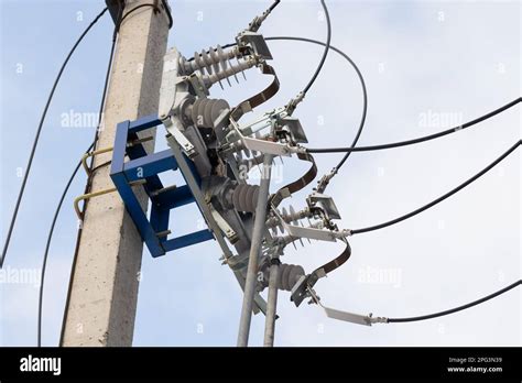 High Voltage Power Line Disconnector Mounted On A Concrete Pole Is