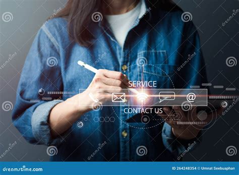 The Woman In Jeans Is Using A Digital Tablet And Interacting With Virtual Contact Icons On The