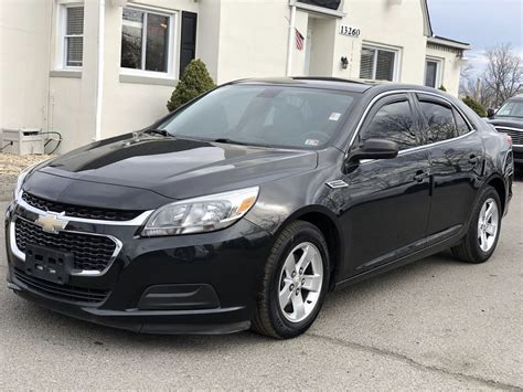 Chevy Malibu Parked In Front Of White House