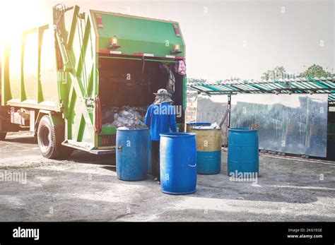 Garbage Transportation Workers Scavengers Take Bins Men Load A Metal Container With Garbage