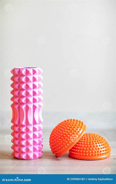 Pink Massage Roller For Neck Shoulders And Back And Orange Foot