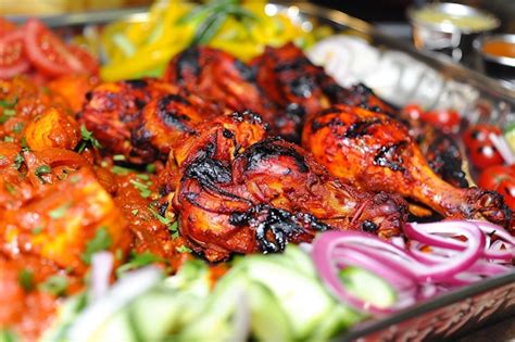 Premium Photo Mouthwatering Tandoori Chicken Feast With Authentic