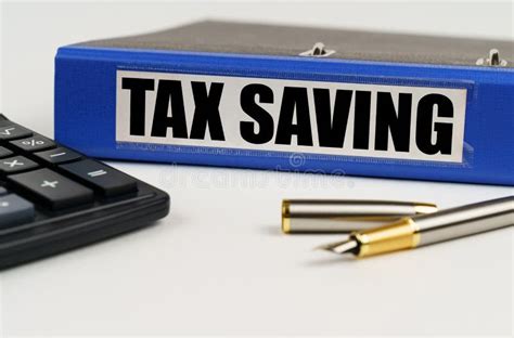 On A White Surface A Calculator A Pen And A Folder With The
