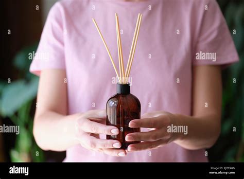 Woman Holds Jar With An Aromatic Diffuser Of Homemade Fragrance In