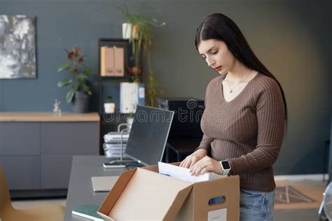 Woman Sorting Through Documents In Folder Box At Office Workplace Stock