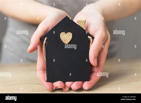 Womans Hand Holding Little Toy House Home Insurance Concept Stock