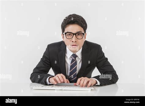 Portrait Of Businessman Typing On Keyboard Stock Photo Alamy
