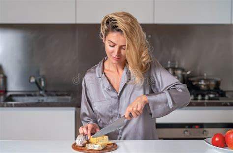 Young Woman Cooking Breakfast Cutting Cheese And Sausage Woman At