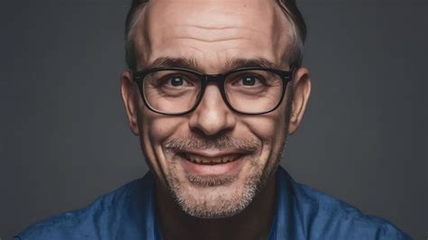 Close Up Portrait Of Caucasian Unshaved Man In Eyeglasses Looking On