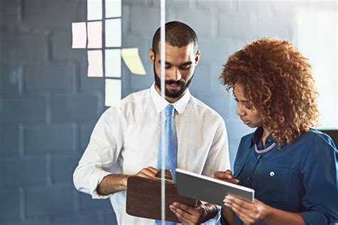 Office People And Meeting On Glass Wall With Clipboard Or Tablet For