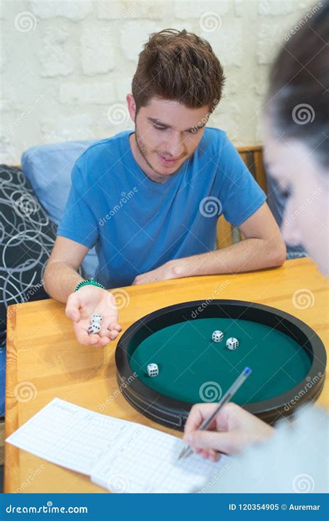 Young Couple Playing Five Dice Game Stock Image Image Of Challenge
