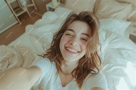 Premium Photo Young Lady Taking A Selfie In The Bed In Her Bedroom In