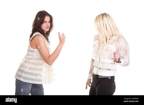 Portrait Of Two Pretty Young Girls Posing Over White Background Stock