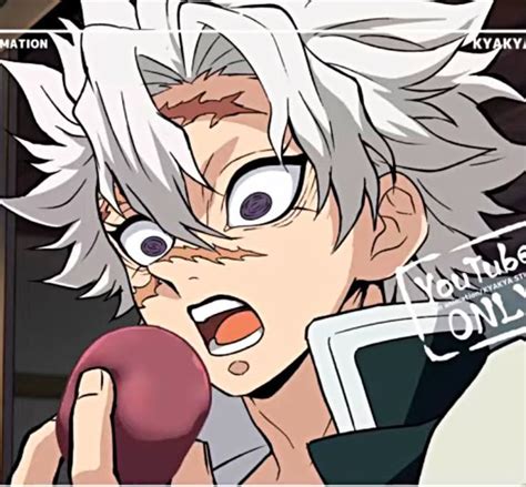 An Anime Character With White Hair And Big Eyes Eating Something Out Of
