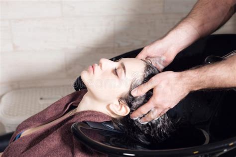 Beautiful Girl Washes Her Hair Before A Haircut In A Beauty Salon Hair