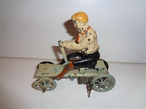 Günthermann Wind up tin toy junge auf holländer handbemalt 1920