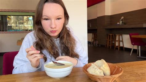 Happy Teenage Girl Eating Soup Sitting In Cafe Girl Eats Romanian