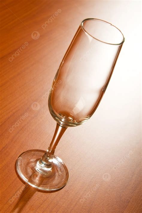 Wine Glasses Against Wooden Background Photo And Picture For Free