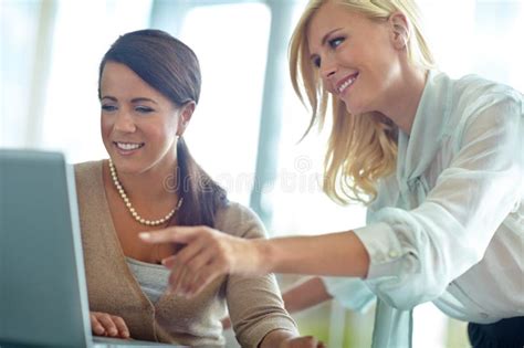 women laptop and point with teamwork in office reading and review for